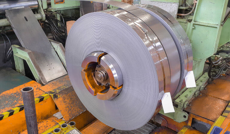 Slitting machine in operation before and during the operation of the ...